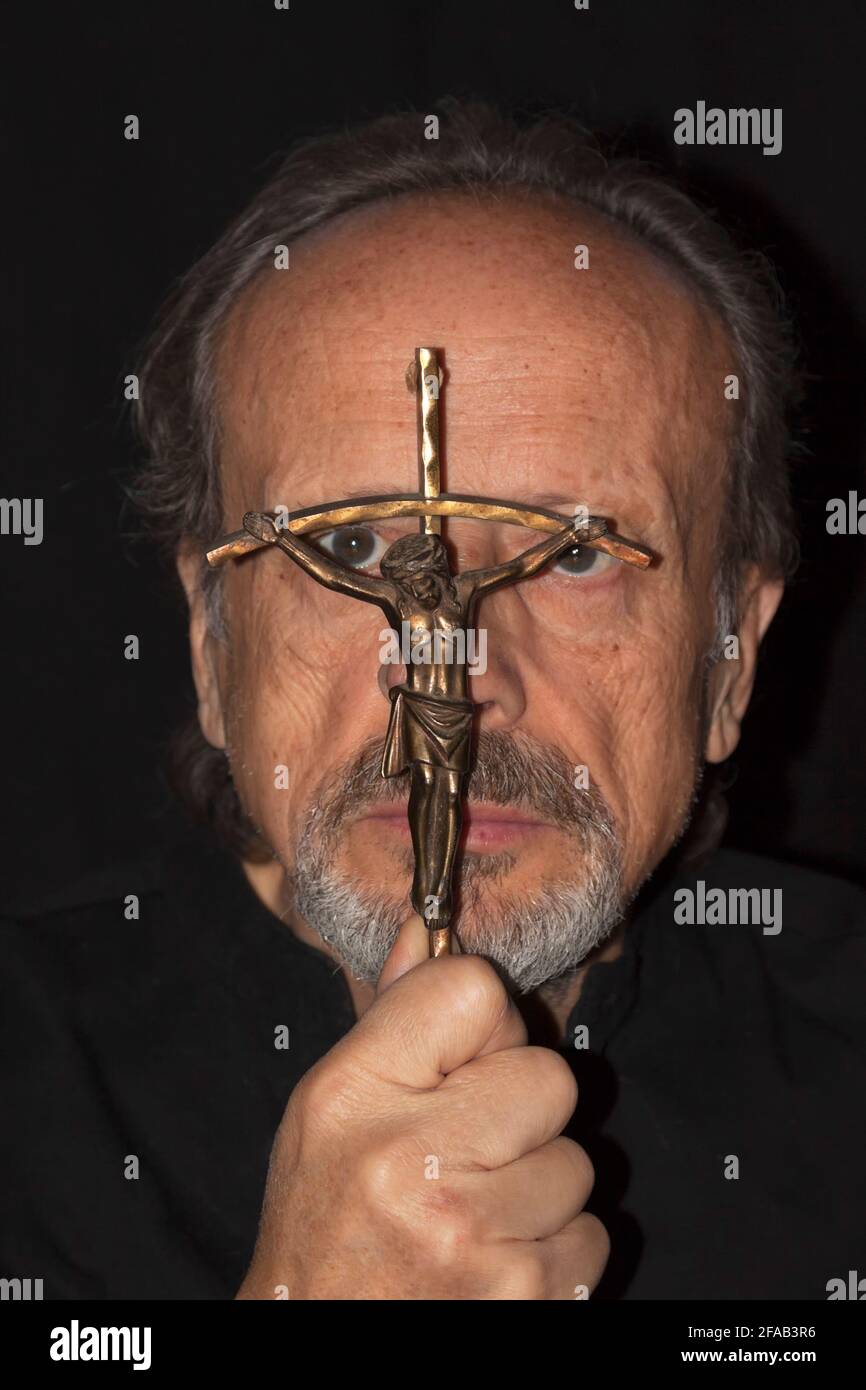 Priest with cross Stock Photo - Alamy