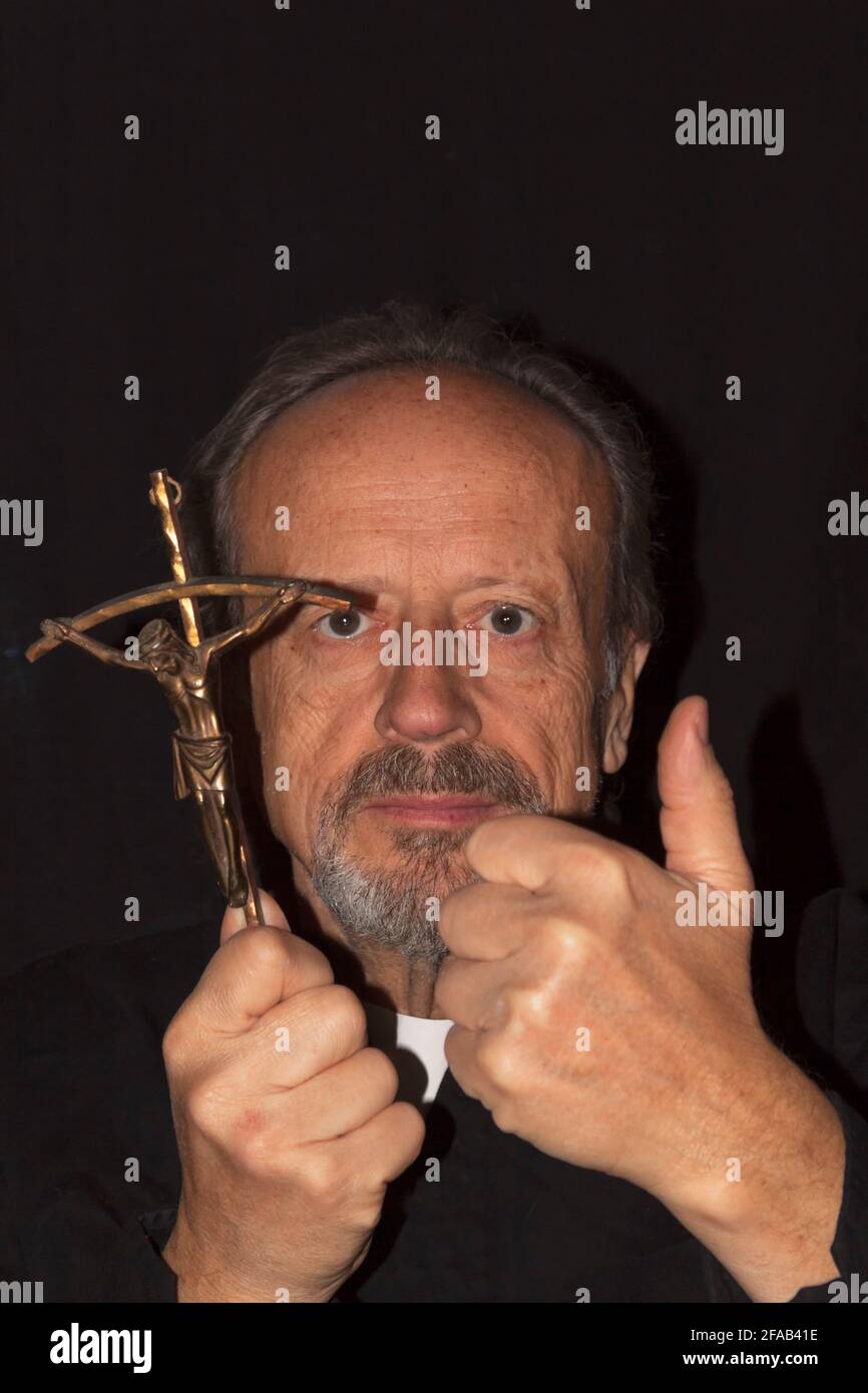 Priest with cross Stock Photo - Alamy