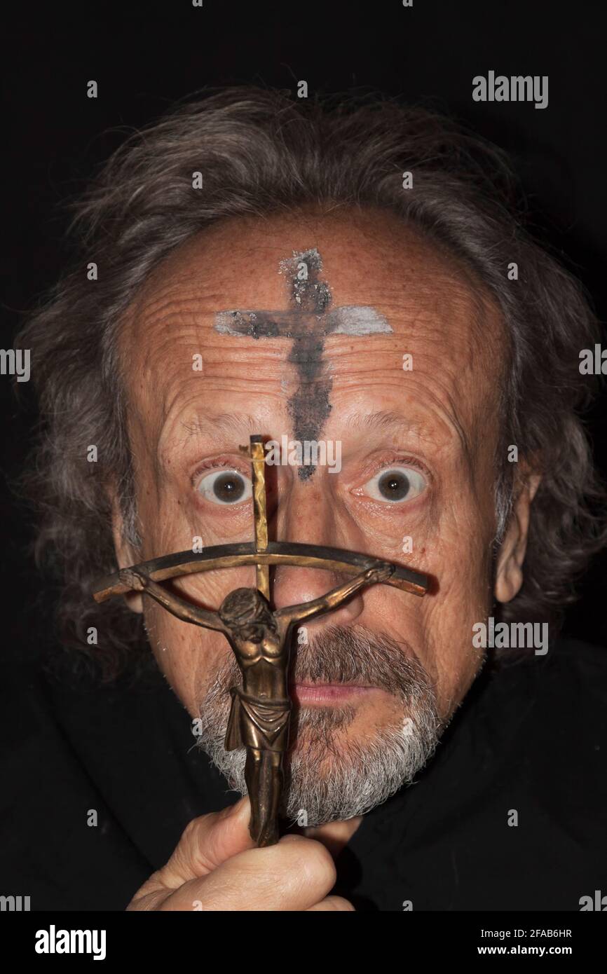 Priest with cross Stock Photo - Alamy