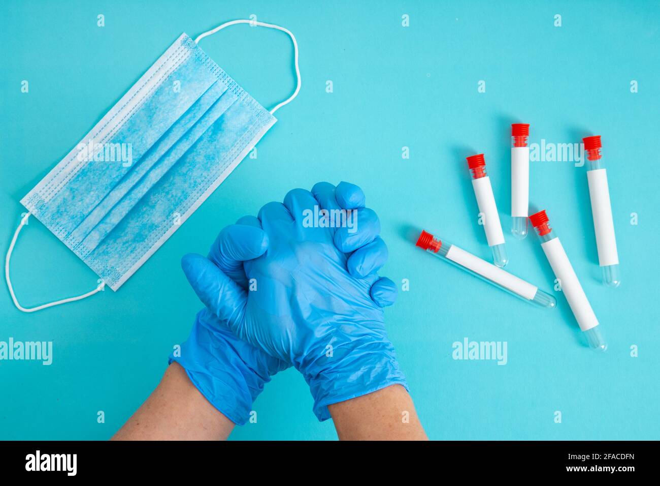 hands wearing blue glove, holding hands to supporting Stock Photo - Alamy