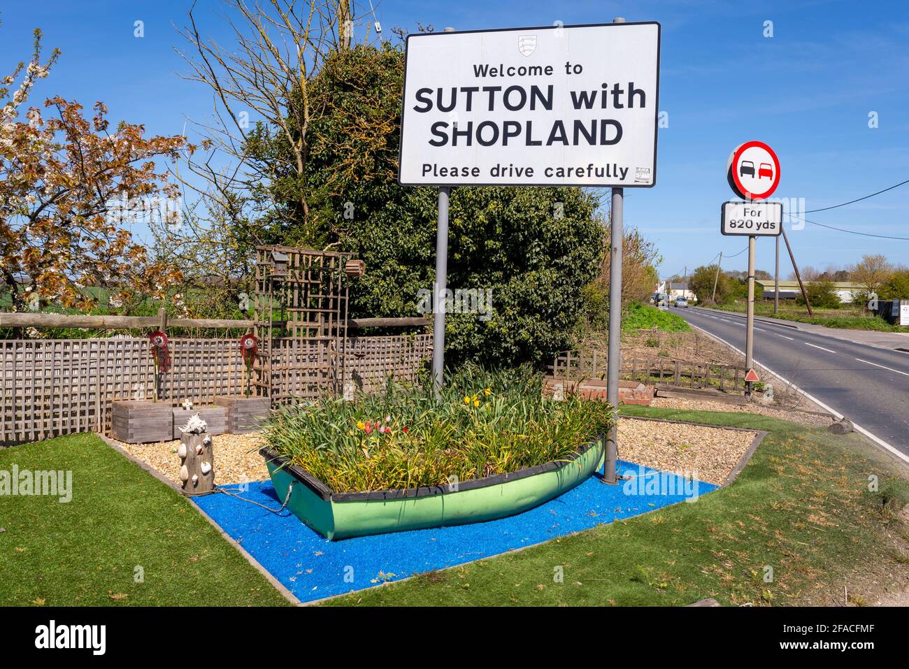 Sutton with Shopland village sign on busy Sutton Road leading in & out ...