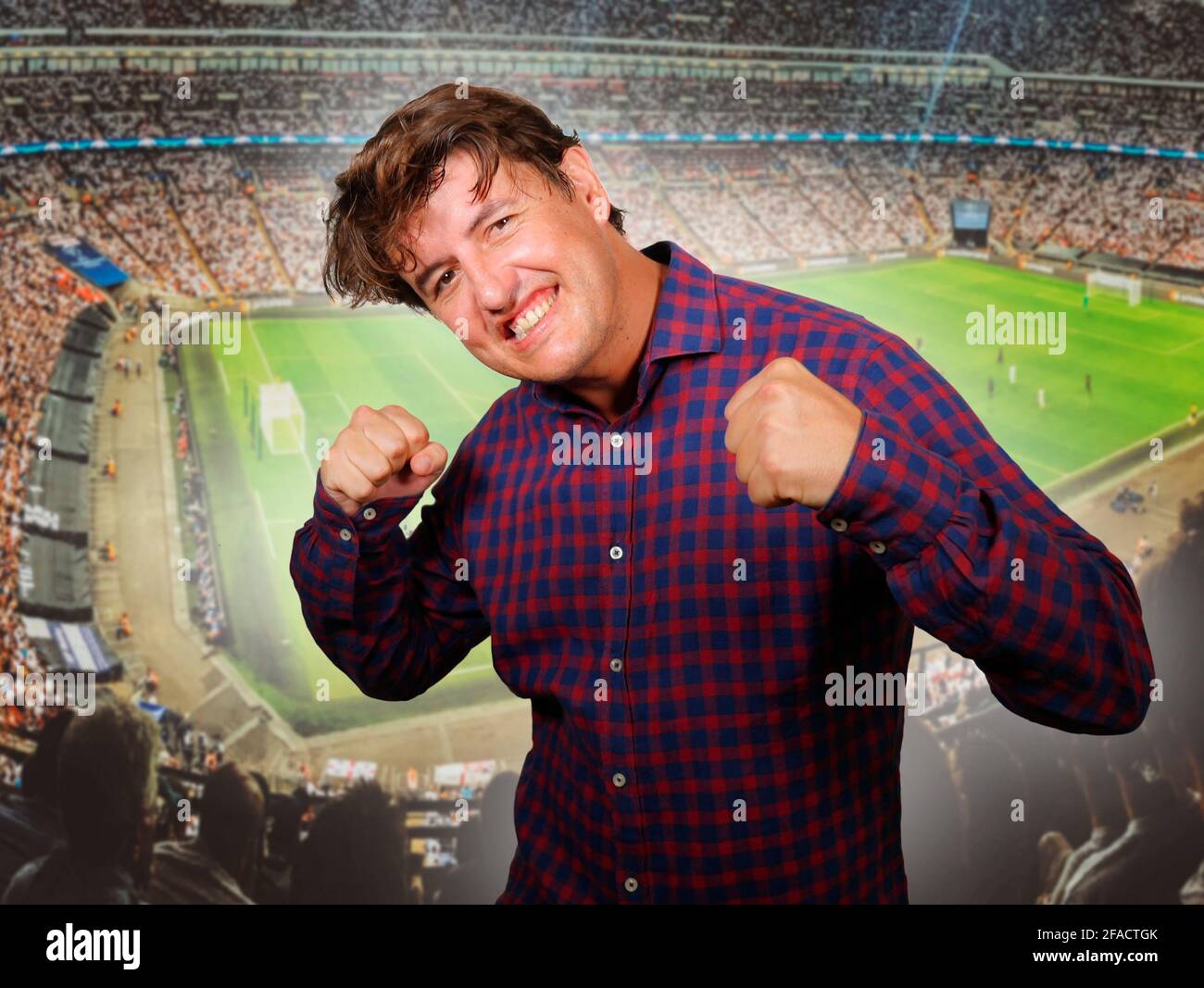 composite with happy and excited soccer fan man and football pitch ...