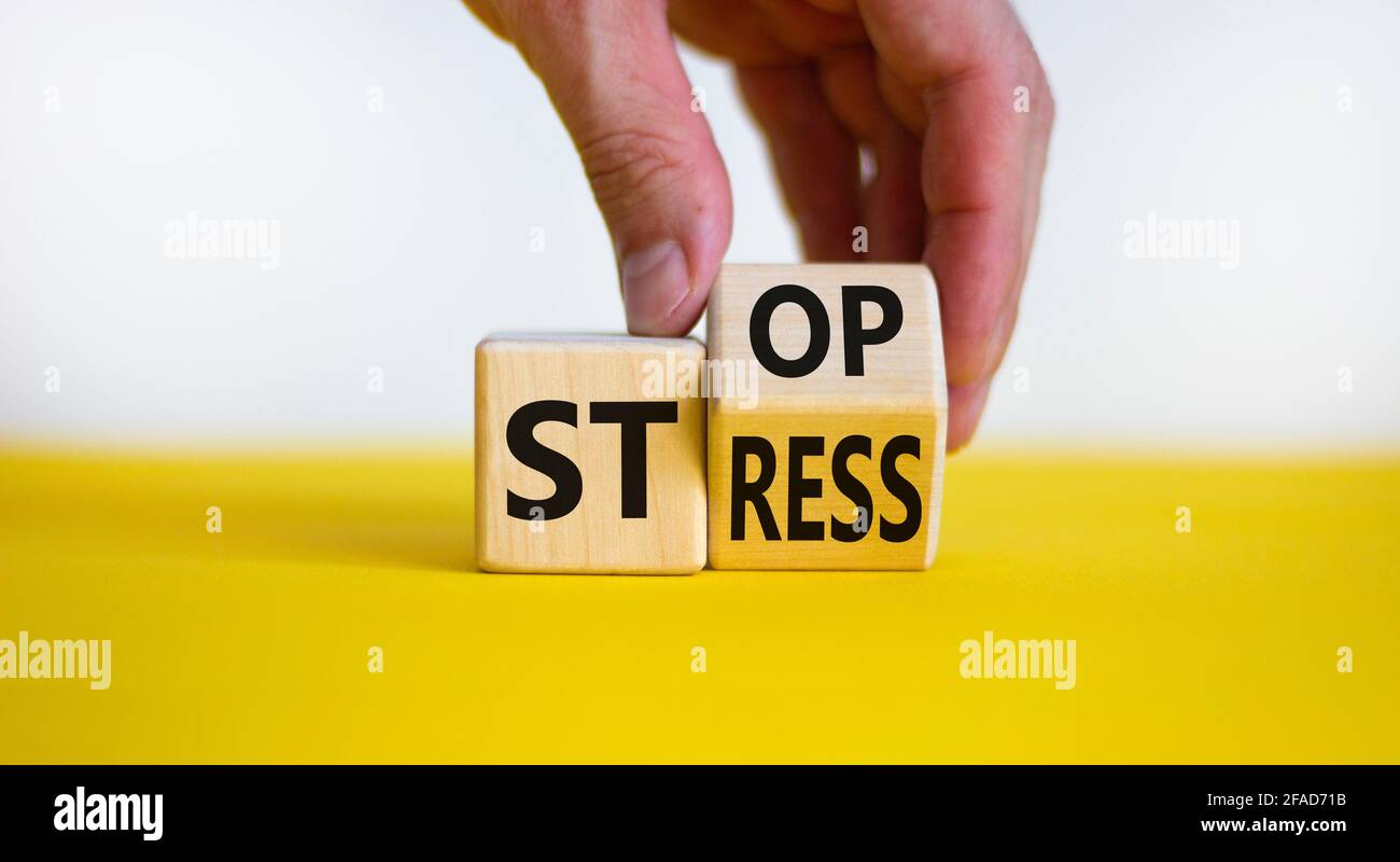 Stop stress and be health symbol. Doctor turns a cube and changes words ...