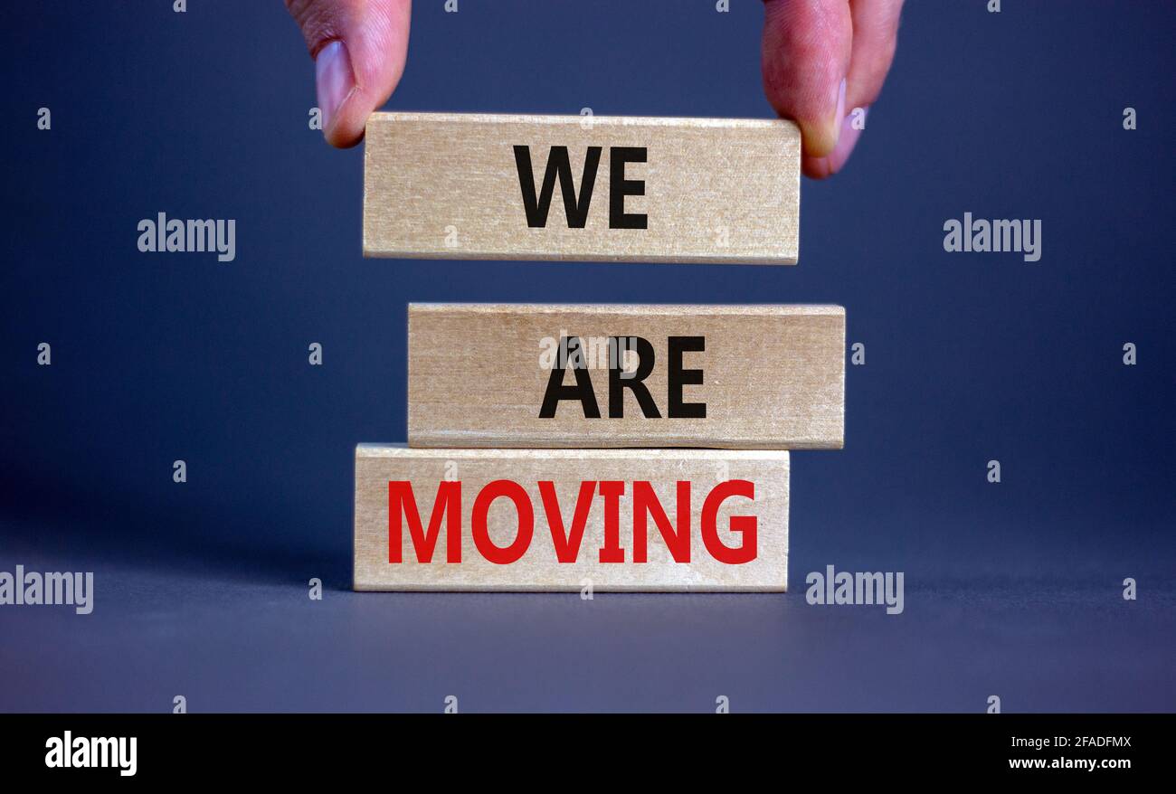 We are moving symbol. Wooden blocks with words 'We are moving ...