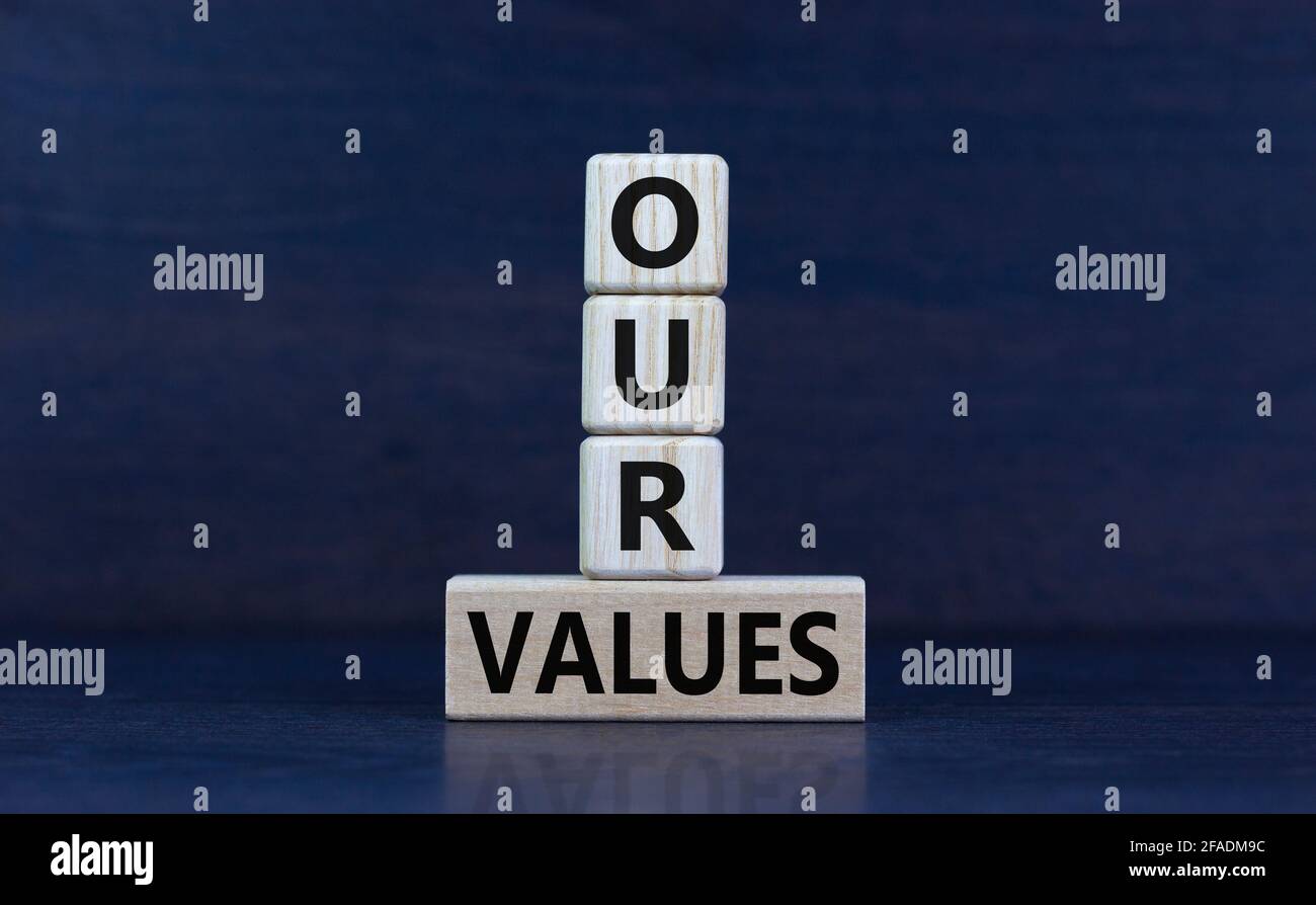 Our values symbol. Wooden cubes and block with words 'our values' on ...