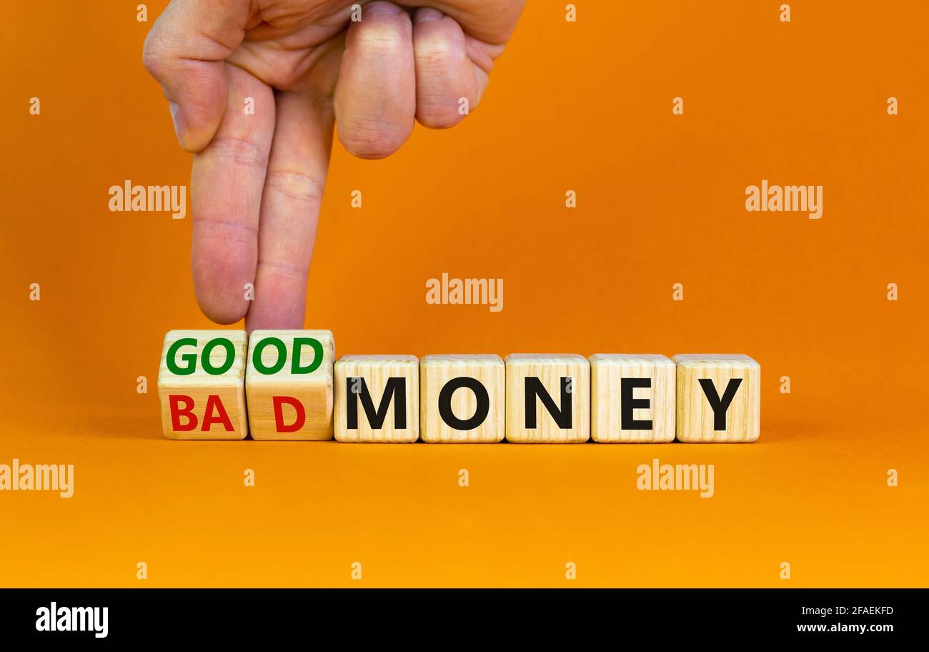 Good or bad money symbol. Businessman turns wooden cubes and changes ...