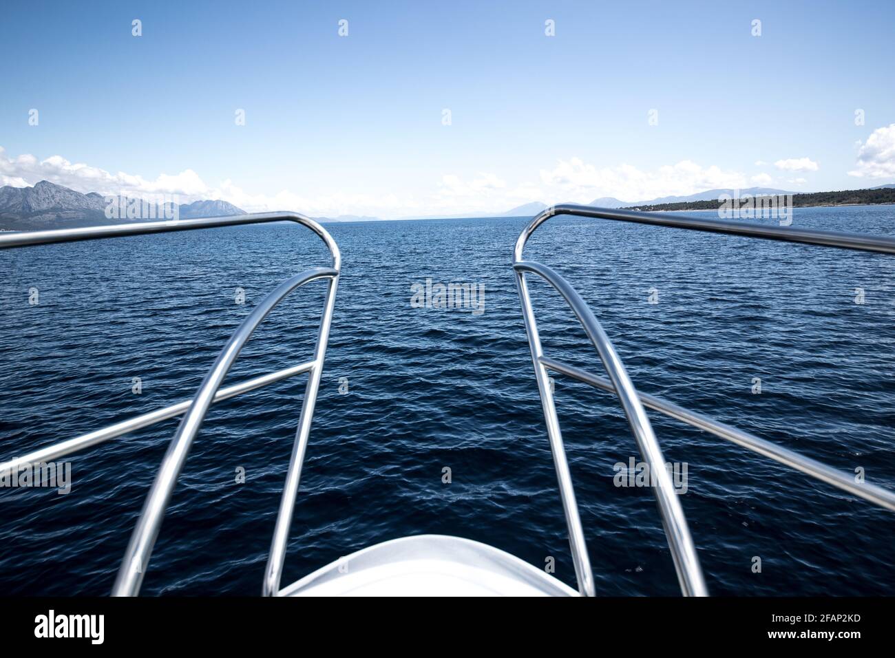 Closeup of metal handrail at the edge of the boat's deck on an ocean ...
