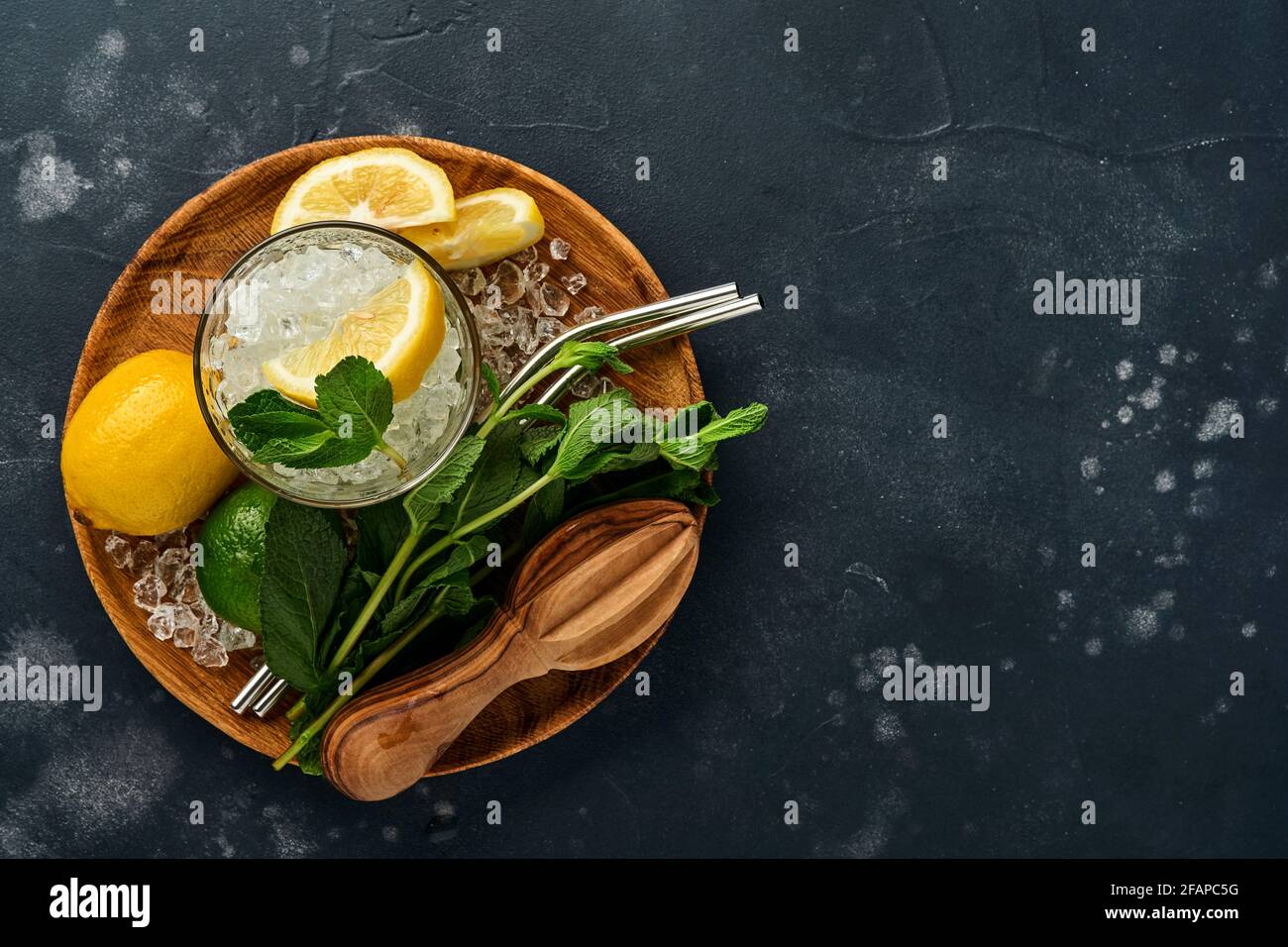 Mojito or Lemonade cocktail in highball glass with ice cubes, mint and ...