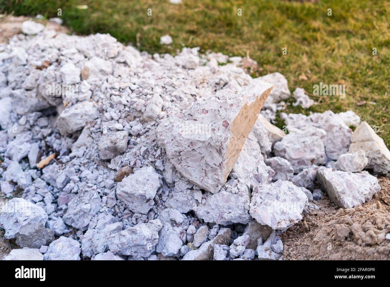 A mountain of construction waste made of concrete stones of different ...