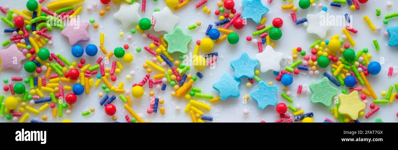 Banner with multicolor festive background of a scattering of sugar ...