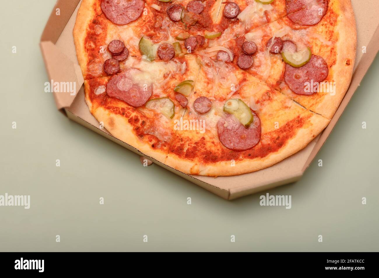 pizza in brown corrugated fiberboard take-out box. round, pizza Stock ...