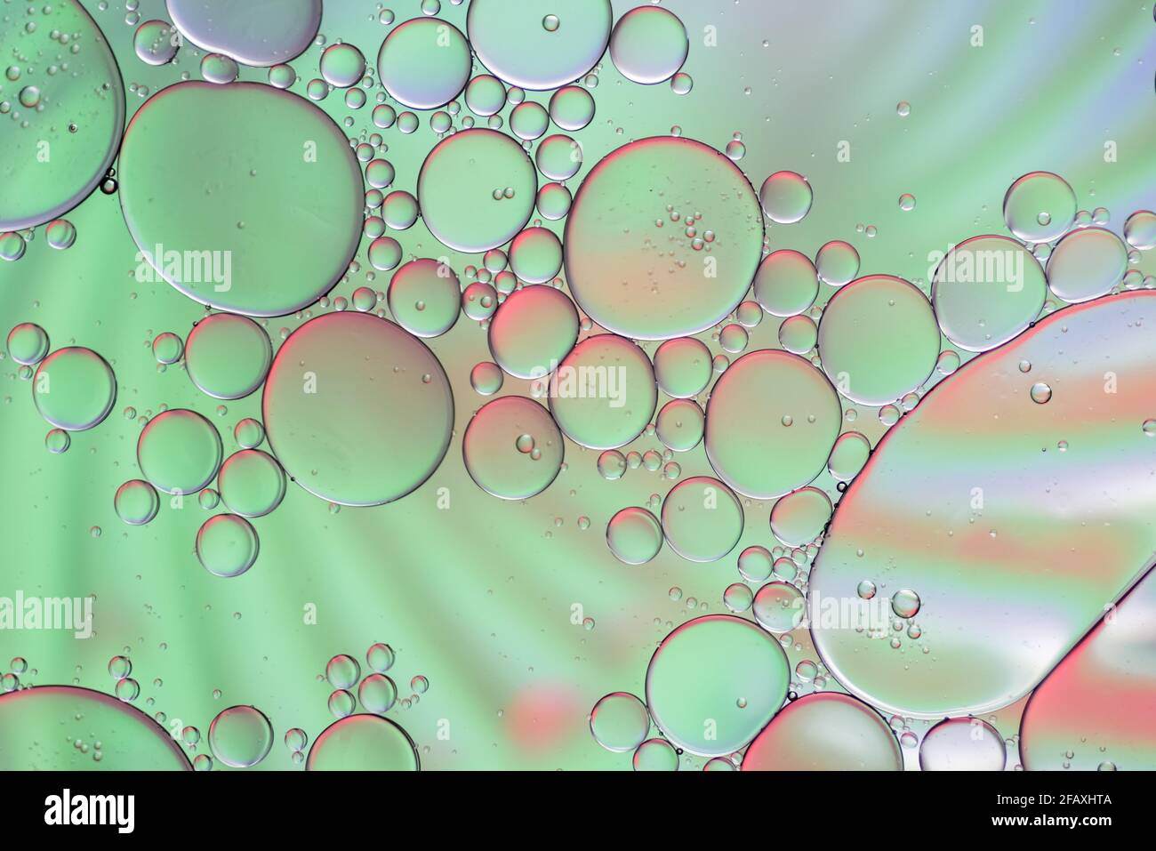 Colorful artistic of oil drop floating on the water Stock Photo - Alamy