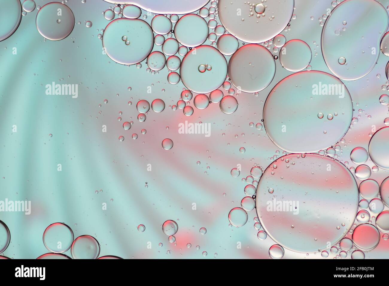 Colorful artistic of oil drop floating on the water Stock Photo - Alamy