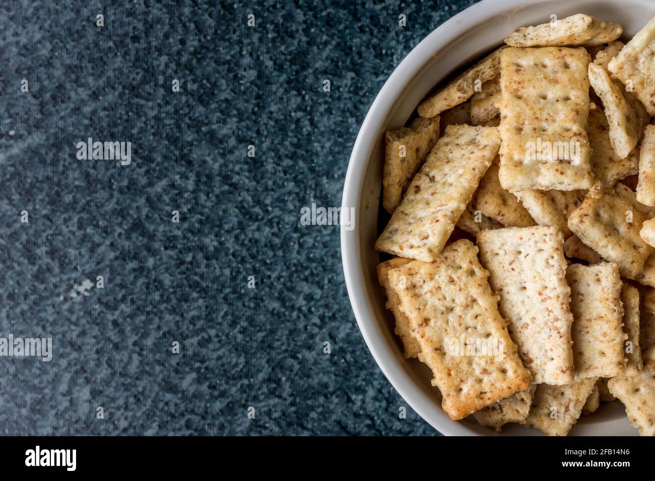 Top view of rectangular crackers in the bowl with copy space Stock ...