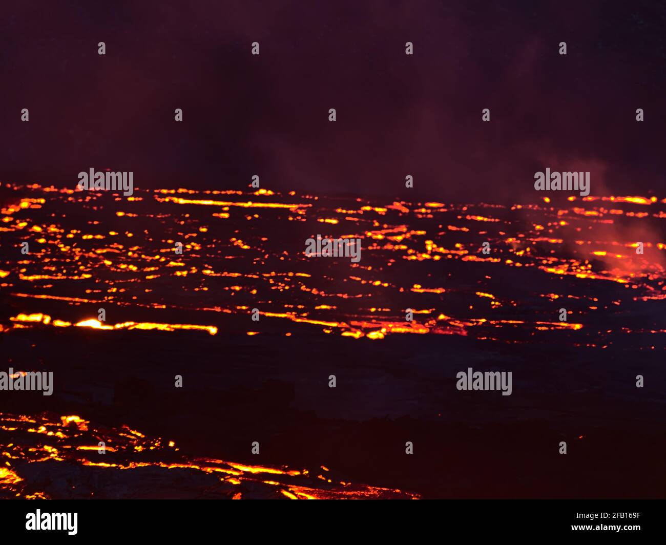 Stunning view of glowing lava flows at volcano eruption site in ...