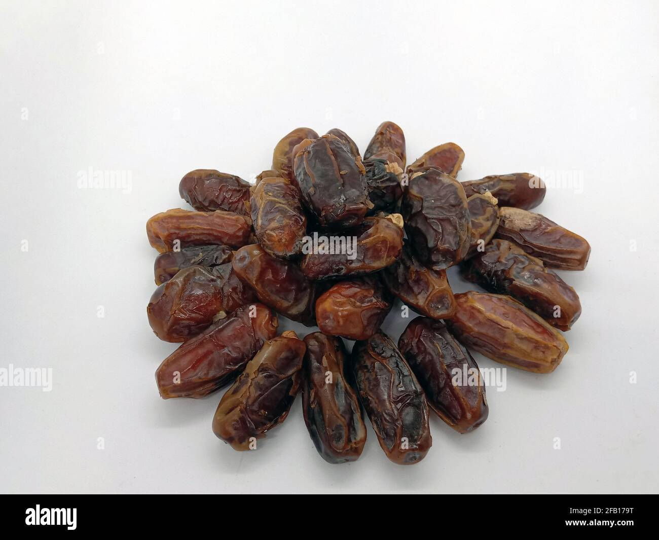 dates stock on white background Stock Photo - Alamy