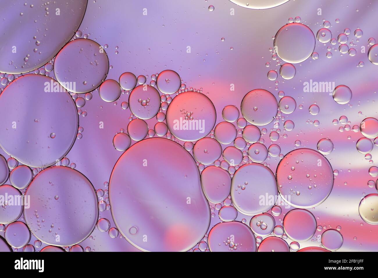 Colorful artistic of oil drop floating on the water Stock Photo - Alamy