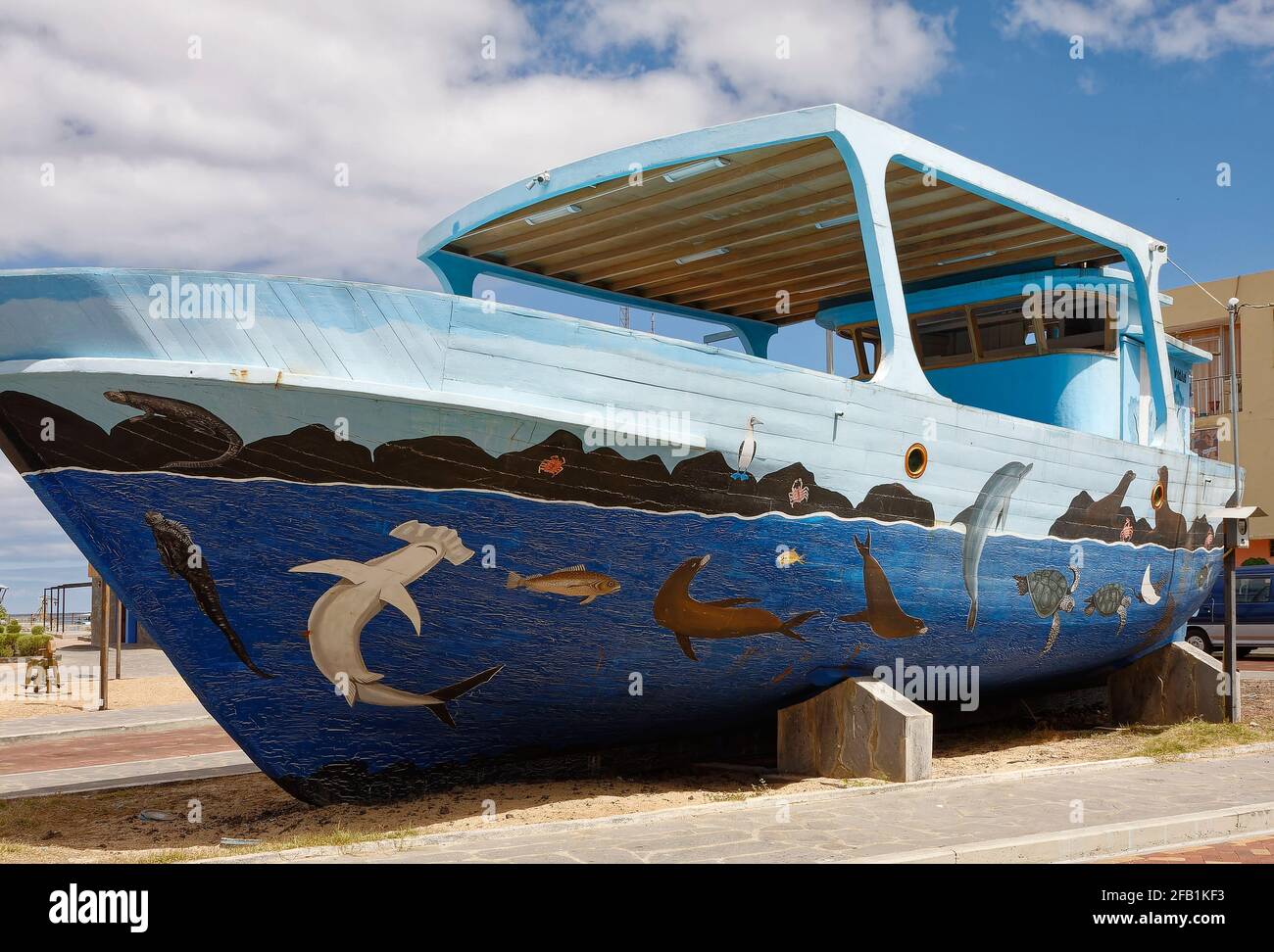old wood boat, decorated, painted sea creatures, on land, harbor, South ...