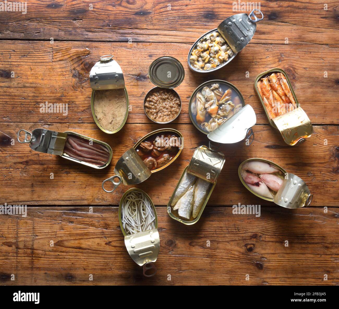 set of cans with fish and seafood on wooden background Stock Photo - Alamy