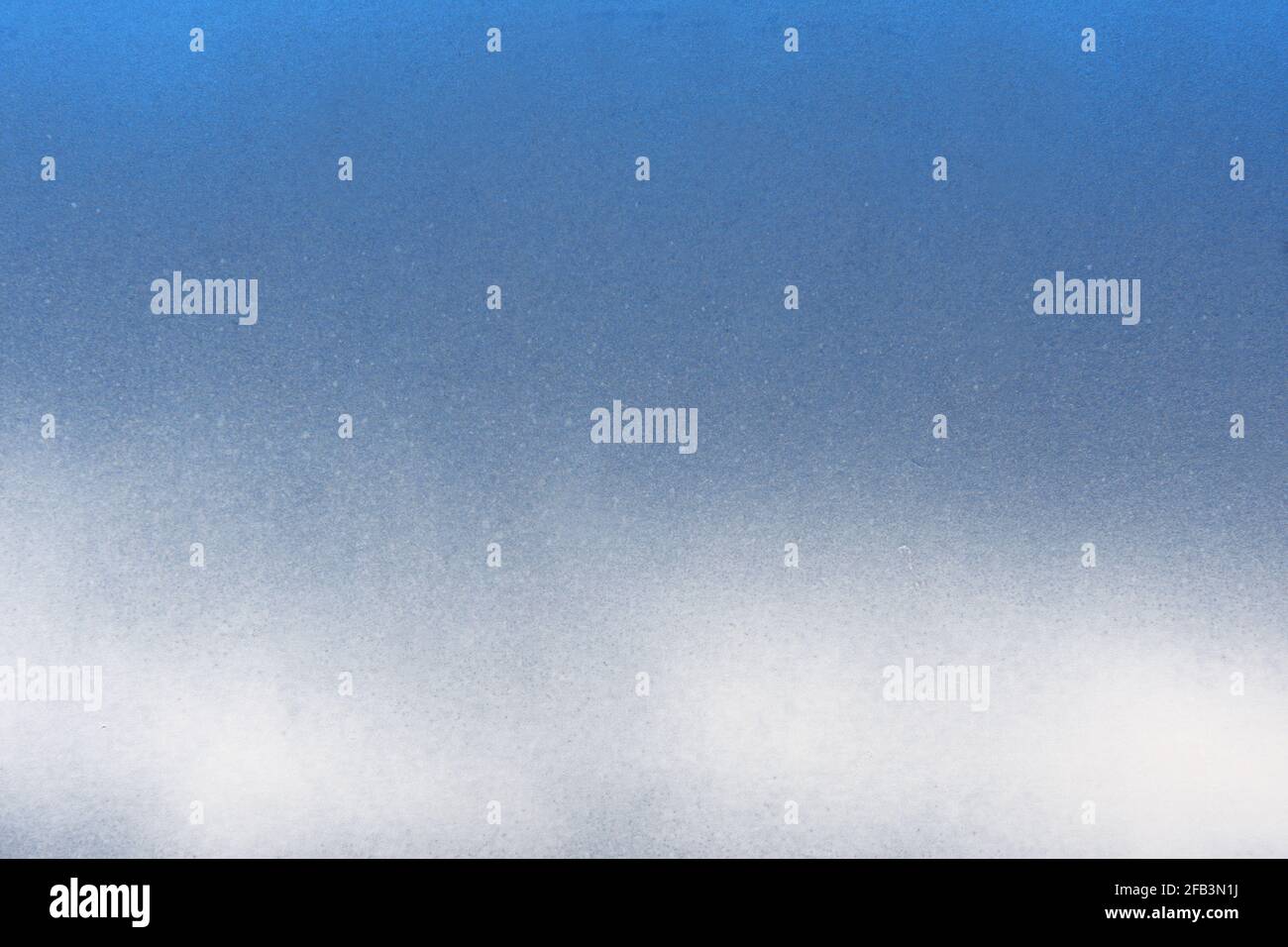 blue and white spray paint on a paper background Stock Photo - Alamy