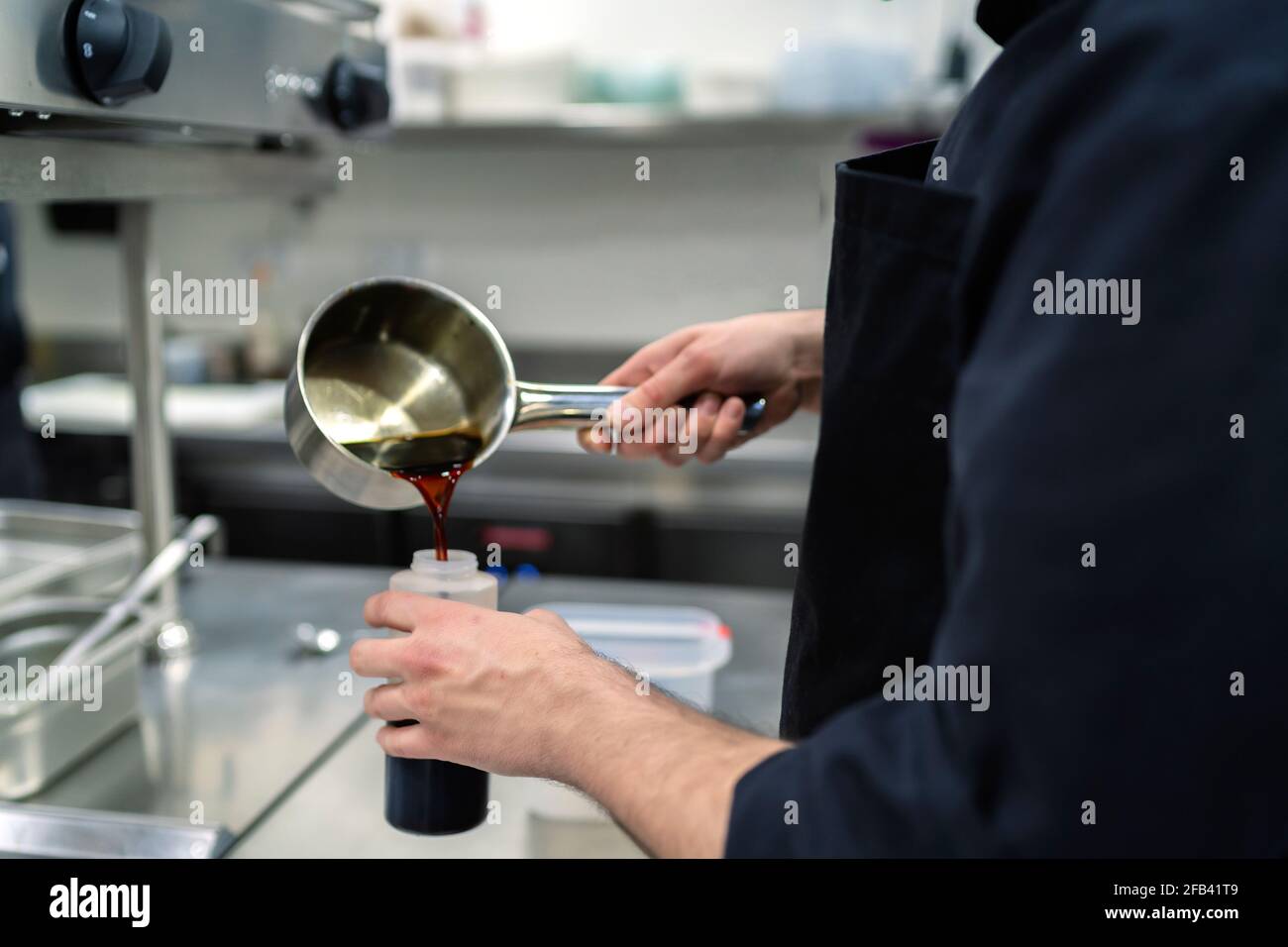 chef preparing sauce for his dishes Stock Photo - Alamy