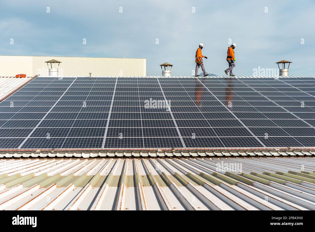 Unrecognizable solar panel technicians checking a Spanish factory Stock ...