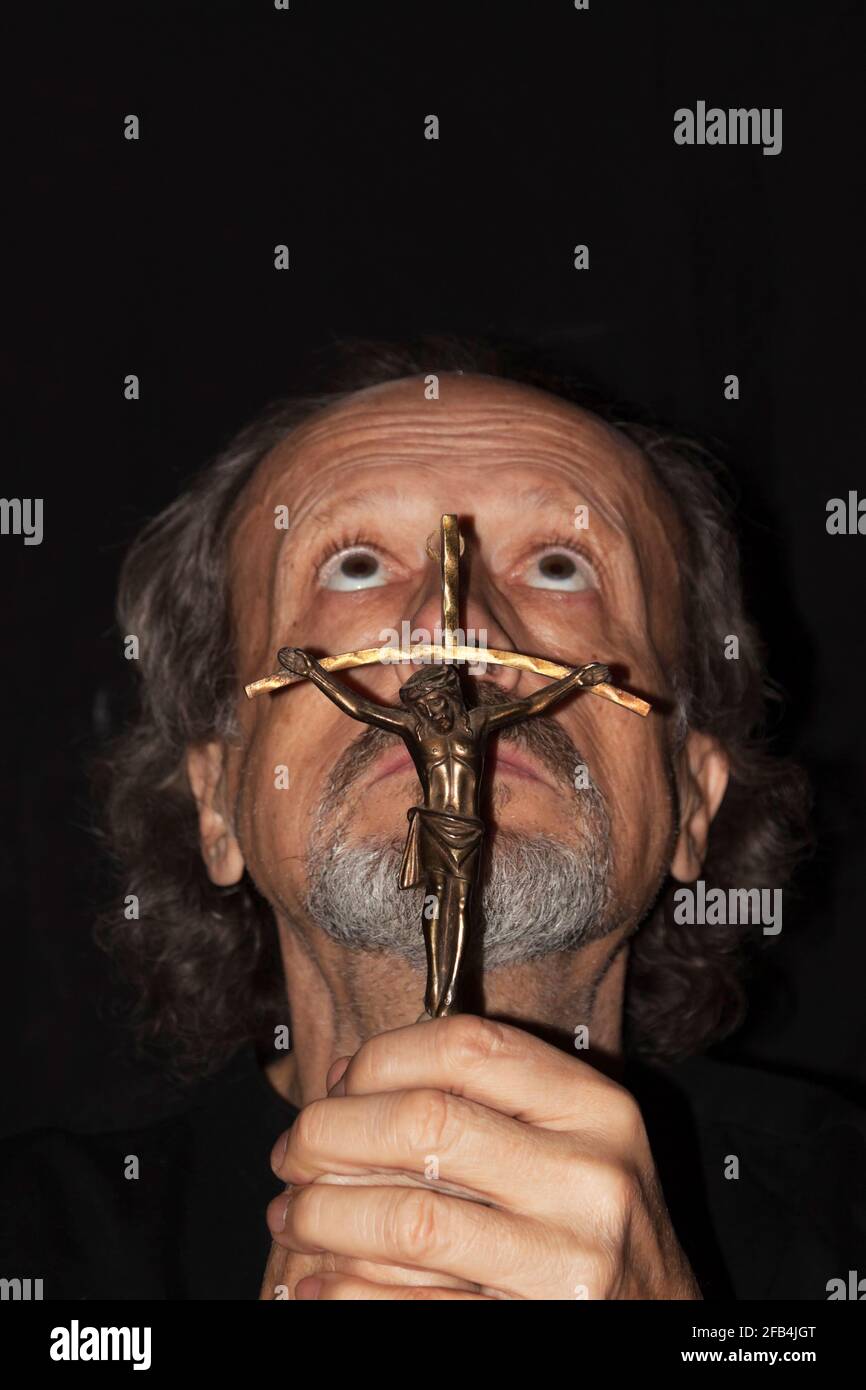 Priest with cross Stock Photo - Alamy