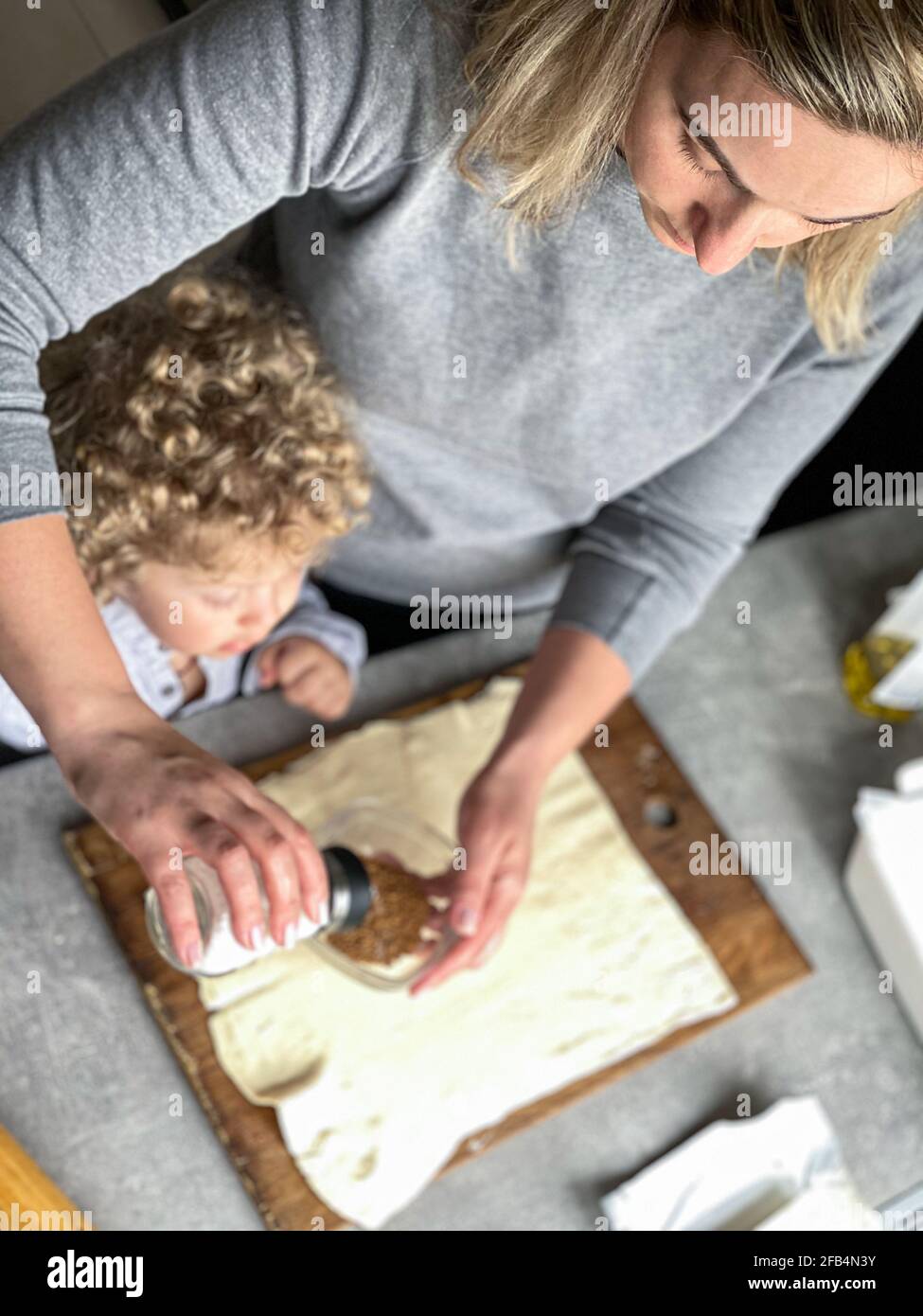 mom and son make cinnamon rolls Stock Photo - Alamy