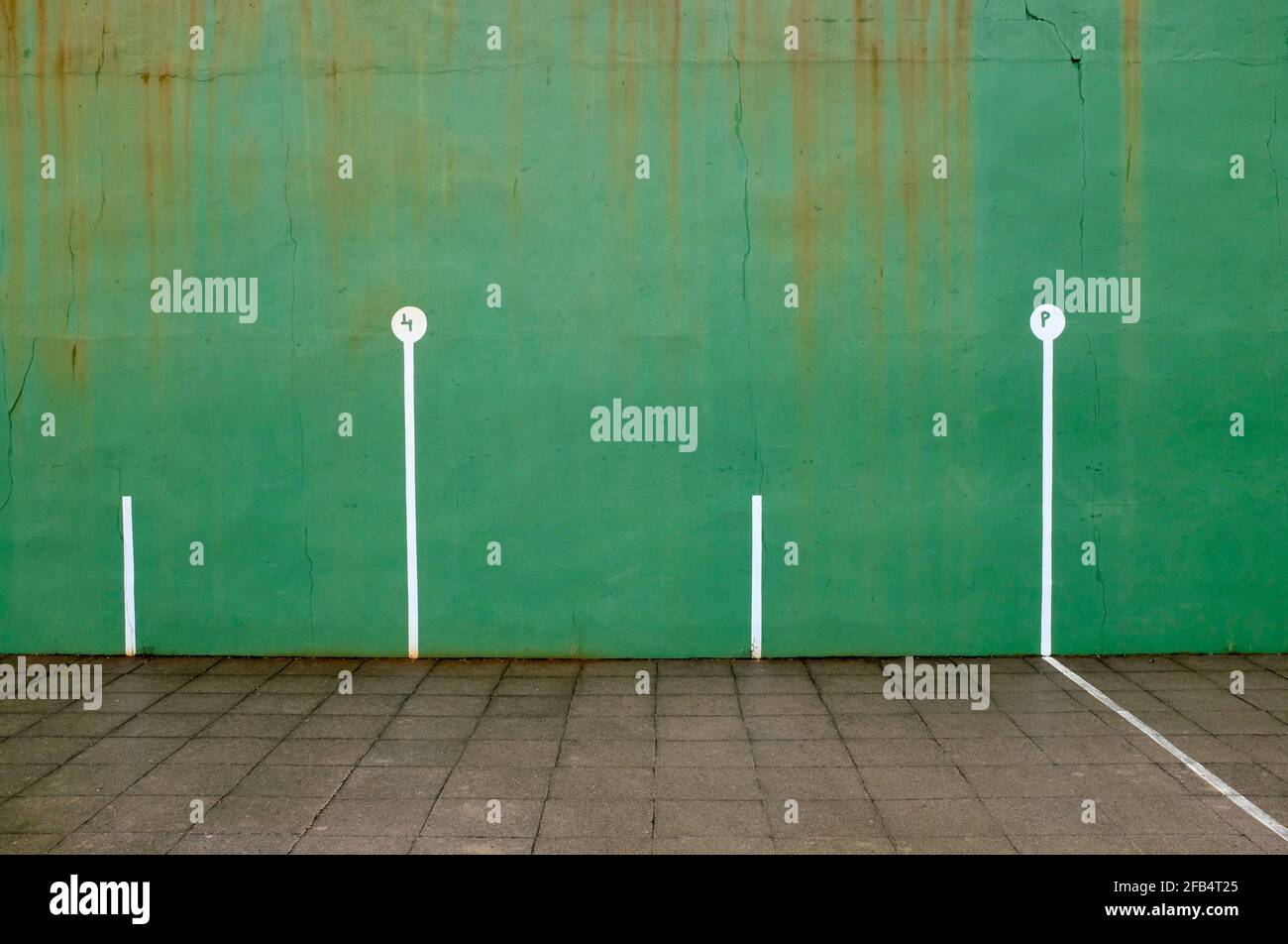 green sports ground with a wall Stock Photo - Alamy