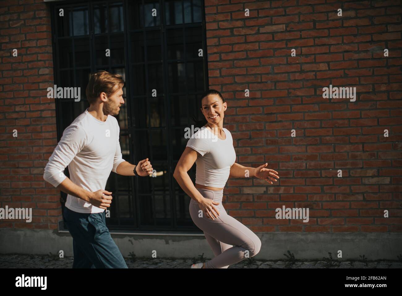 Young happy couple runners hi-res stock photography and images - Alamy