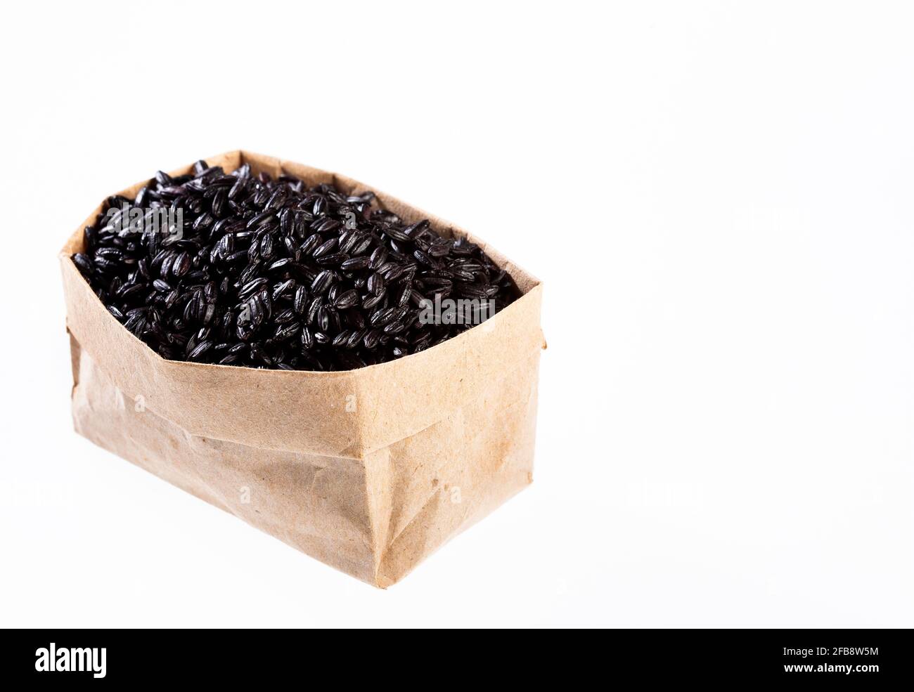 Organic Black Rice in paper bag - Oryza sativa Stock Photo - Alamy