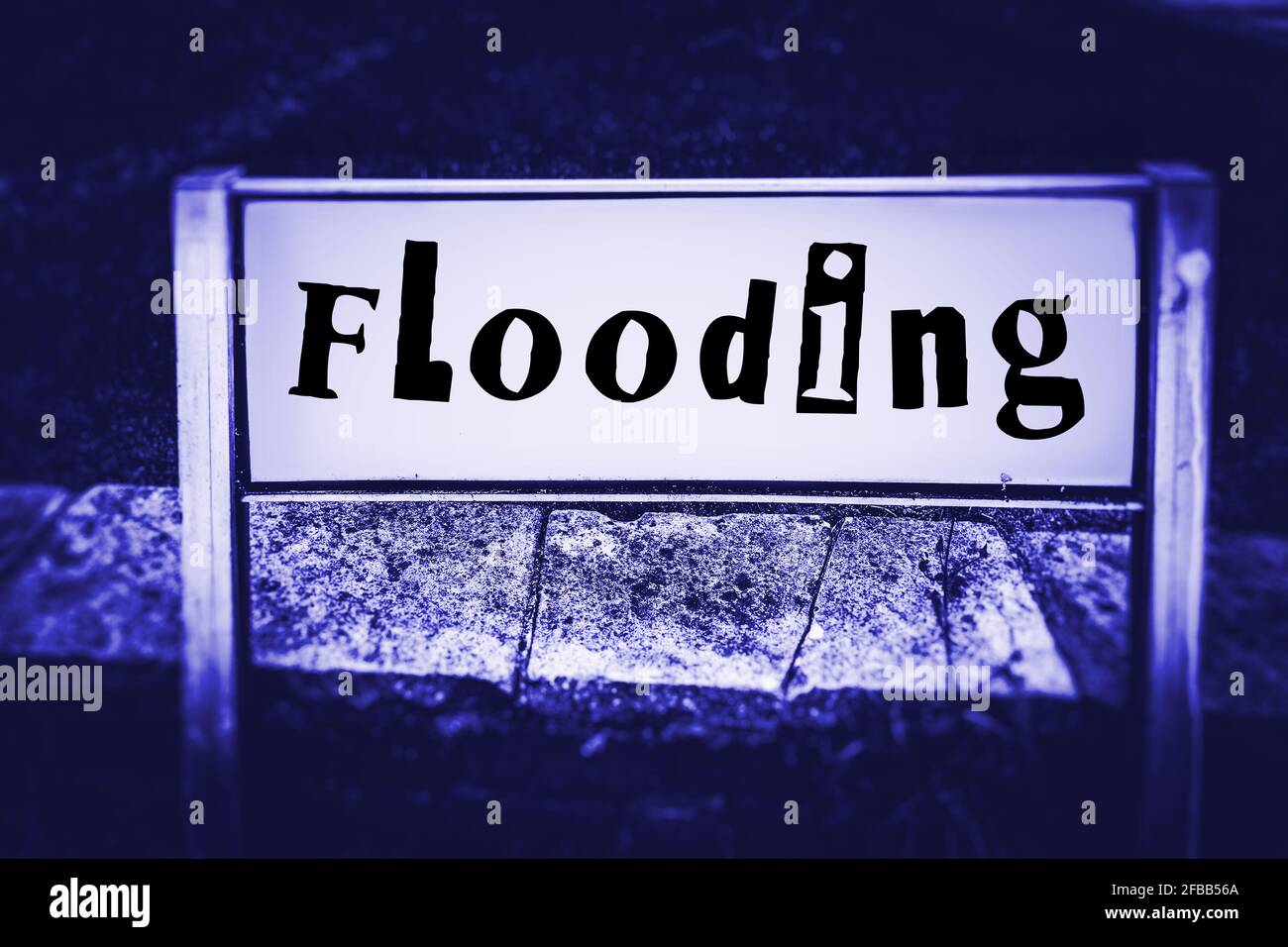 Flooding displayed on a road sign Stock Photo - Alamy