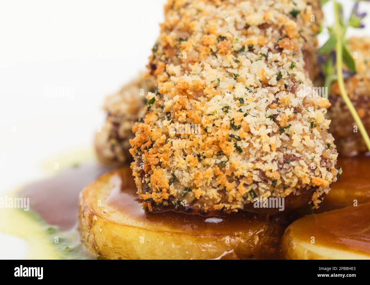 Breaded pork fillet with baked potatoes. Macro. Photo can be used as a ...