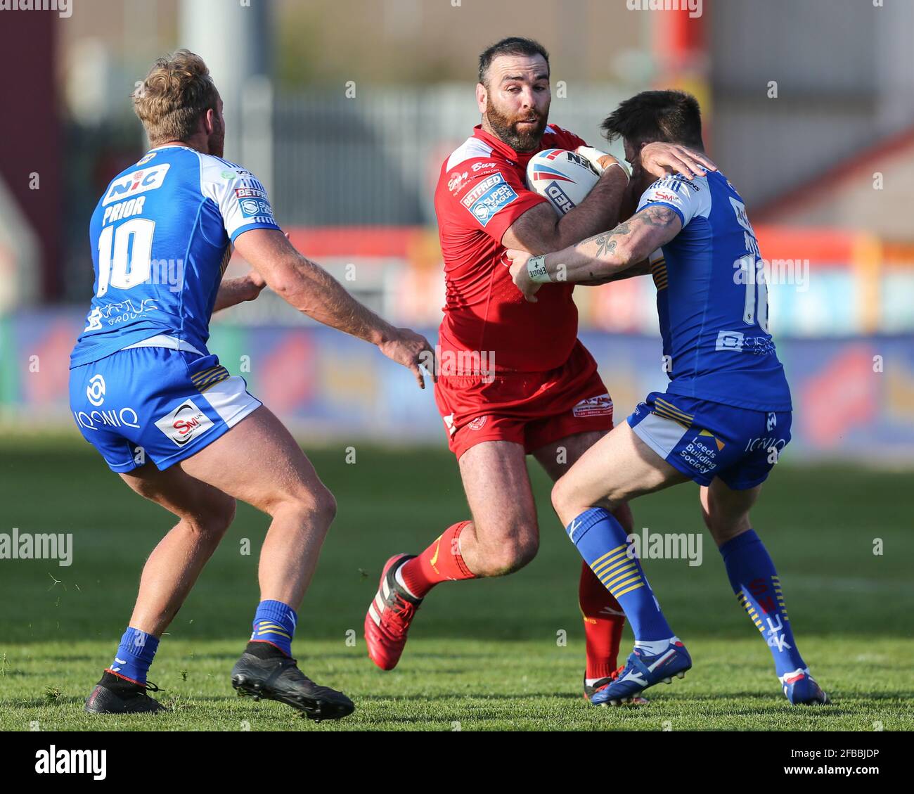 Kane Linnett (12) of Hull KR runs at the Leeds defence Stock Photo - Alamy