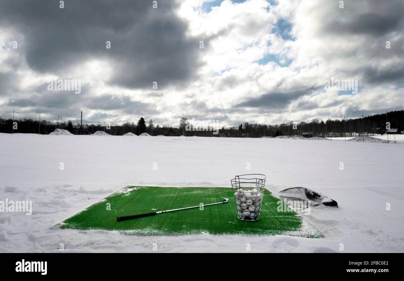 Golf club and golf balls on a driving range during a winter day Stock ...