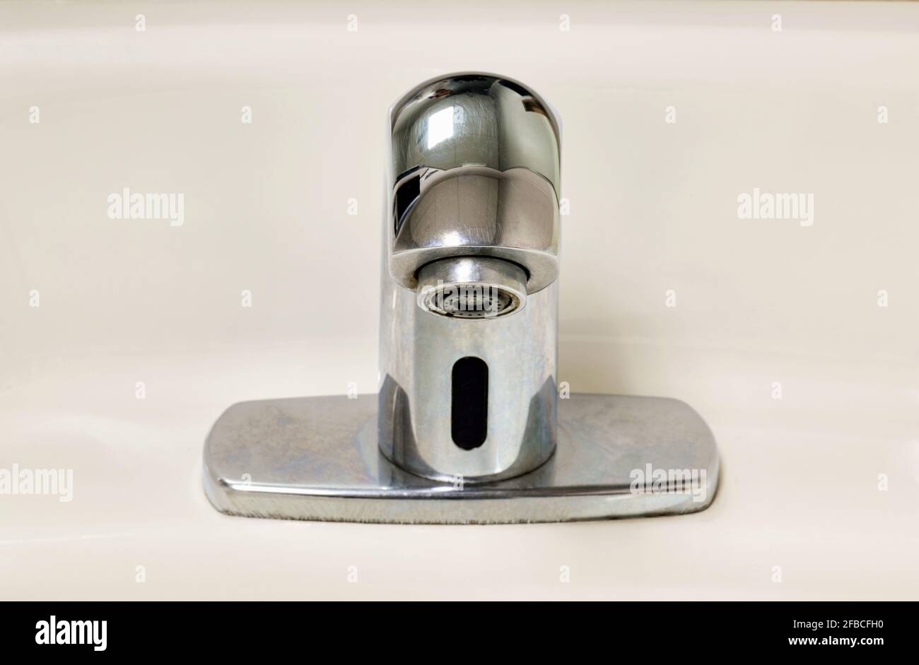 Touchless automated bathroom faucet showing sensor, front view eye ...