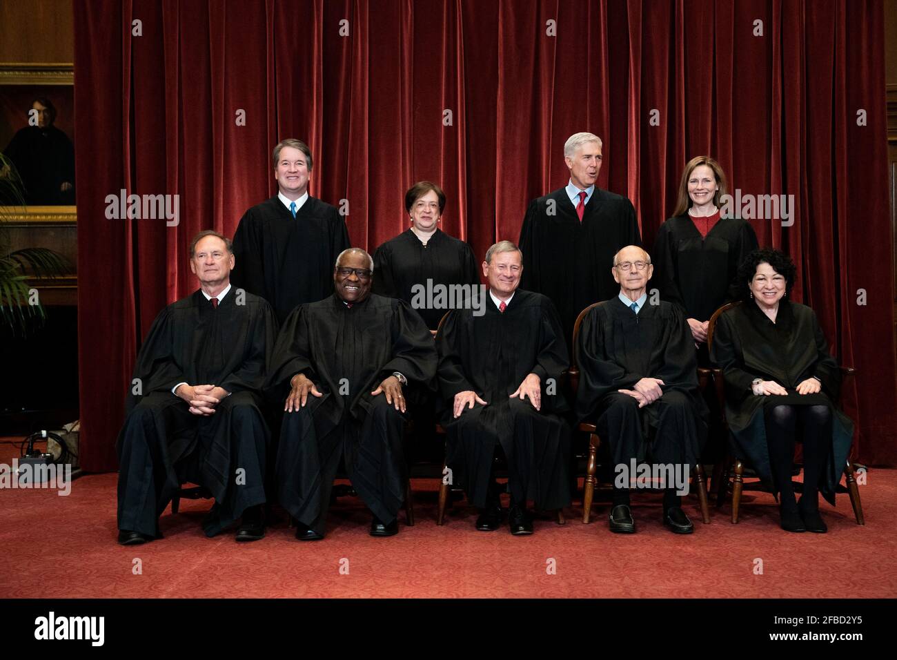 Supreme court judges seated standing hi-res stock photography and ...