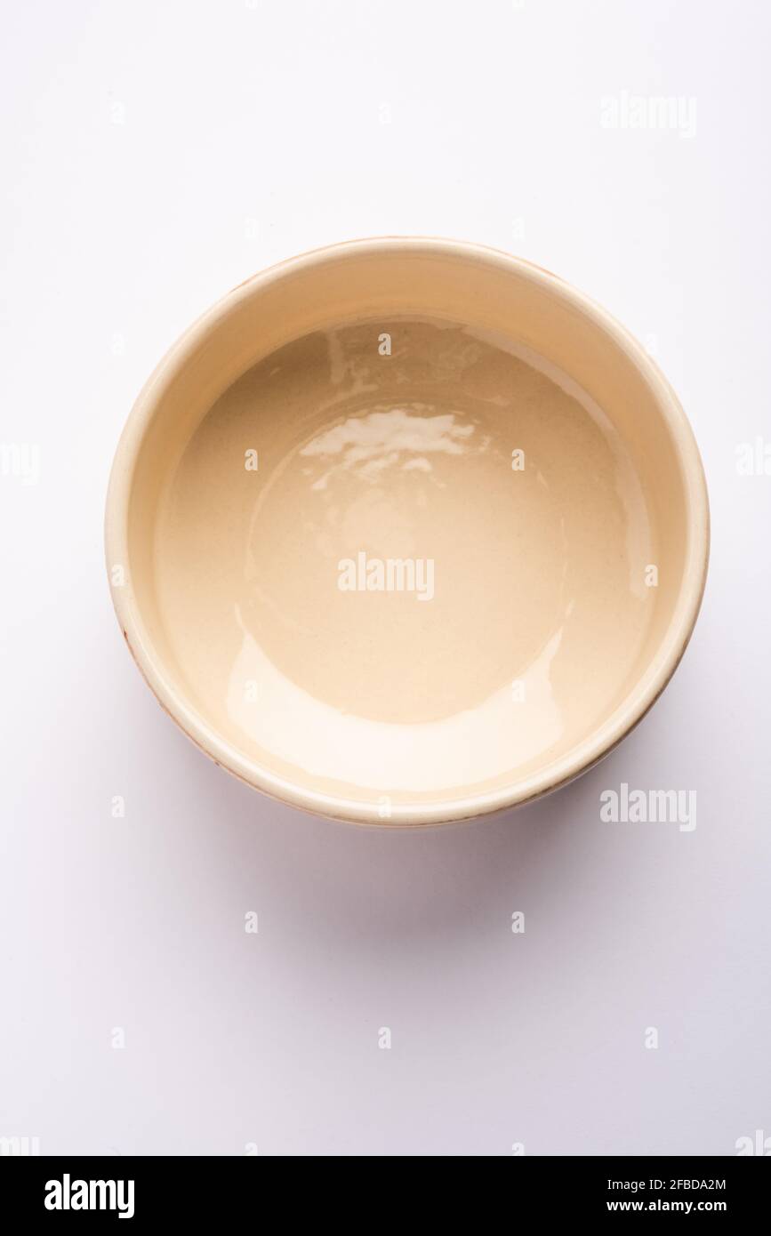 Empty brown ceramic serving bowl, isolated over white or gray ...