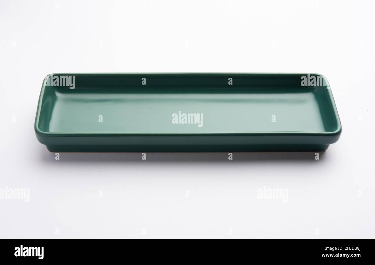 Empty green ceramic rectangular plate isolated on white background ...