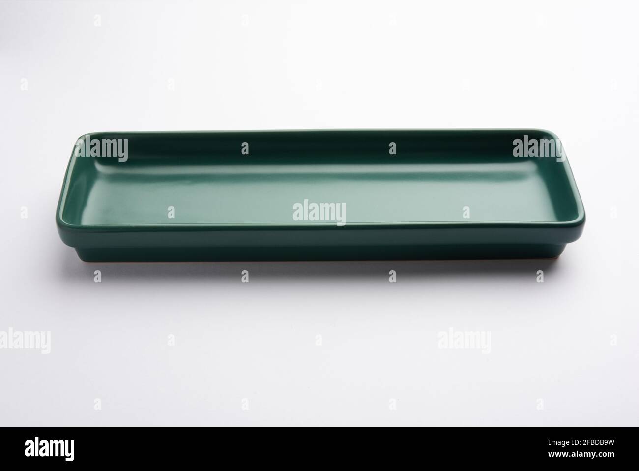 Empty green ceramic rectangular plate isolated on white background ...
