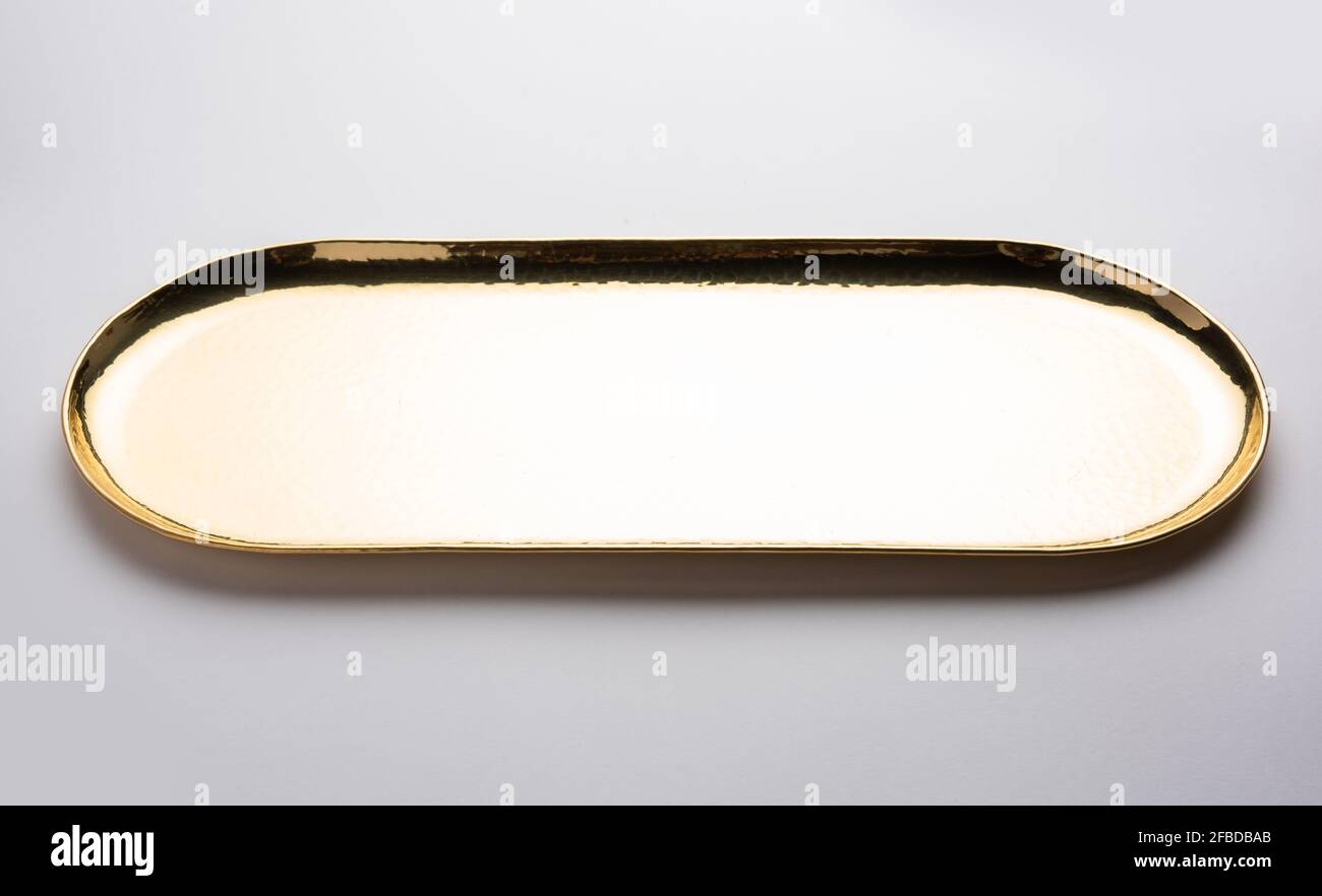 Empty oval or round shape thali or plate made up of brass, pital or ...