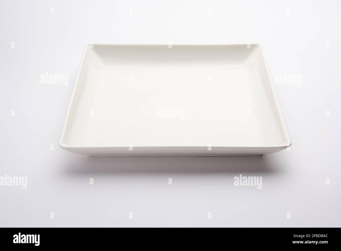 Empty white ceramic square plate isolated on white background Stock ...