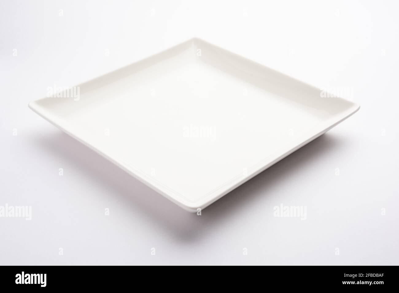 Empty white ceramic square plate isolated on white background Stock ...