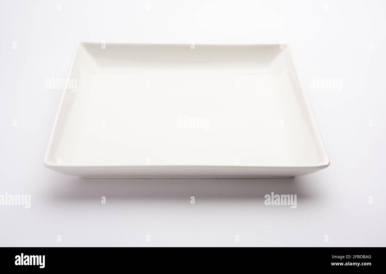 Empty white ceramic square plate isolated on white background Stock ...