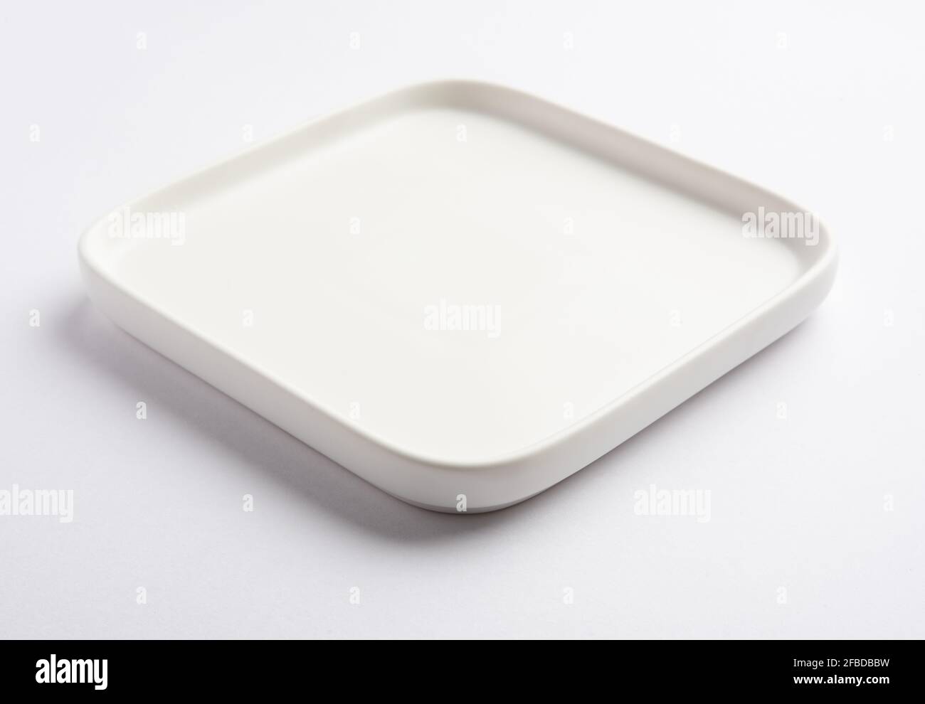 Empty white ceramic square plate isolated on white background Stock ...