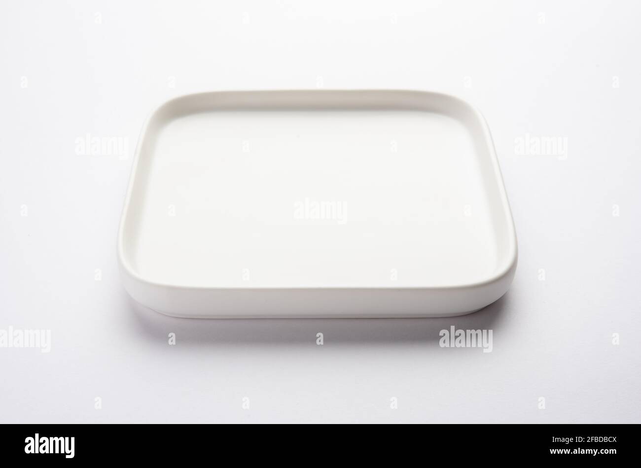 Empty white ceramic square plate isolated on white background Stock ...