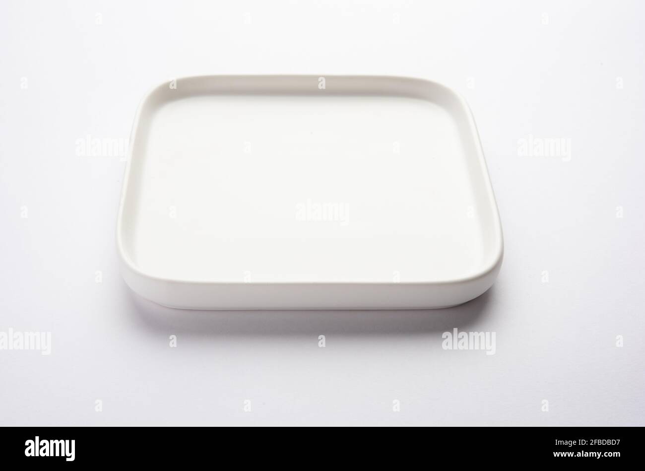 Empty white ceramic square plate isolated on white background Stock ...