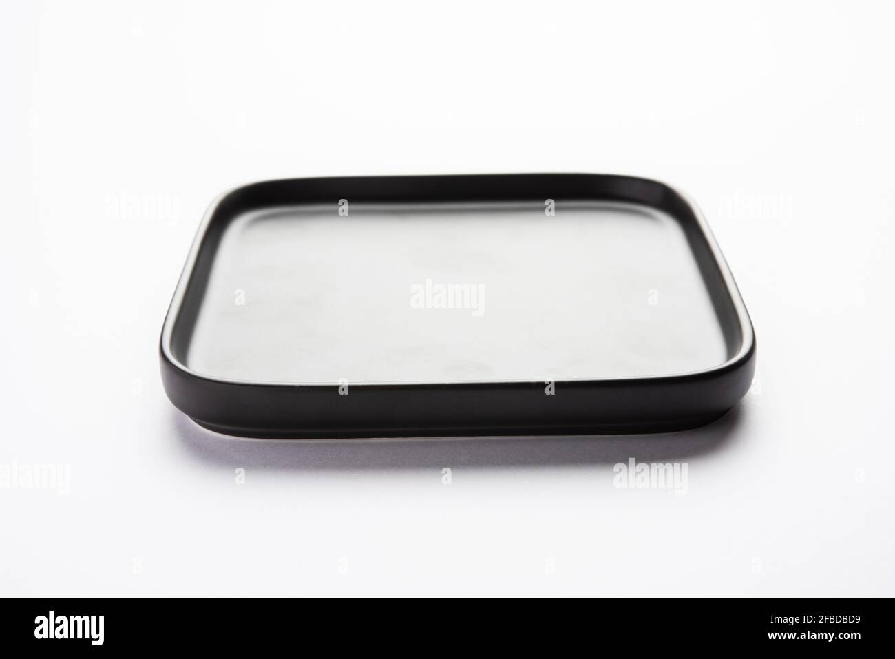 Empty black ceramic square plate isolated on white background Stock ...