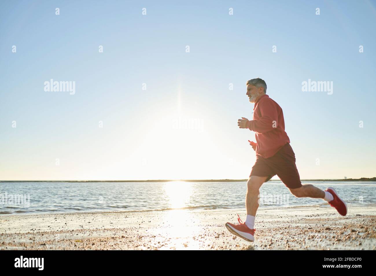 Jogging at beach High Resolution Stock Photography and Images - Alamy