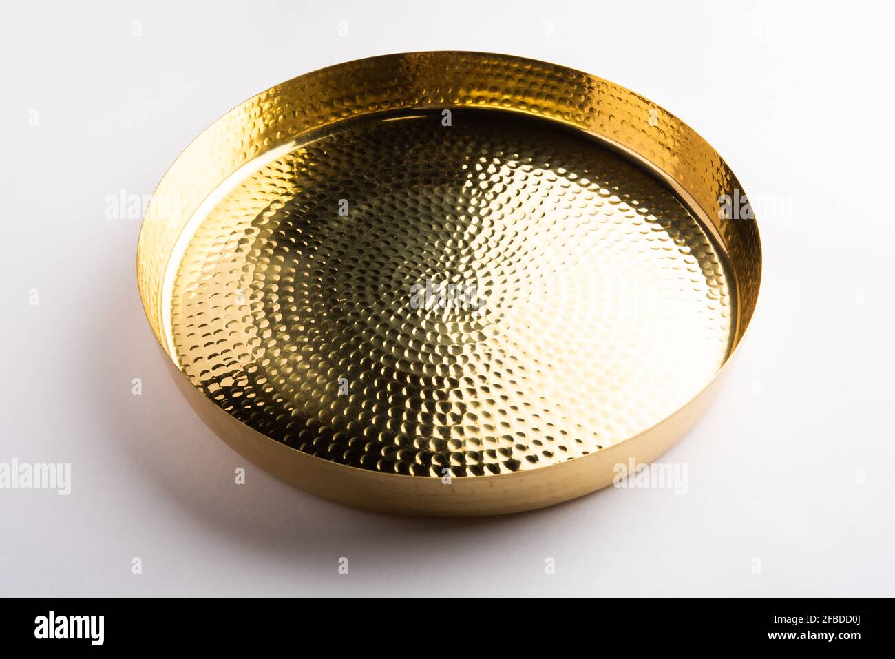 Empty oval or round shape thali or plate made up of brass, pital or ...